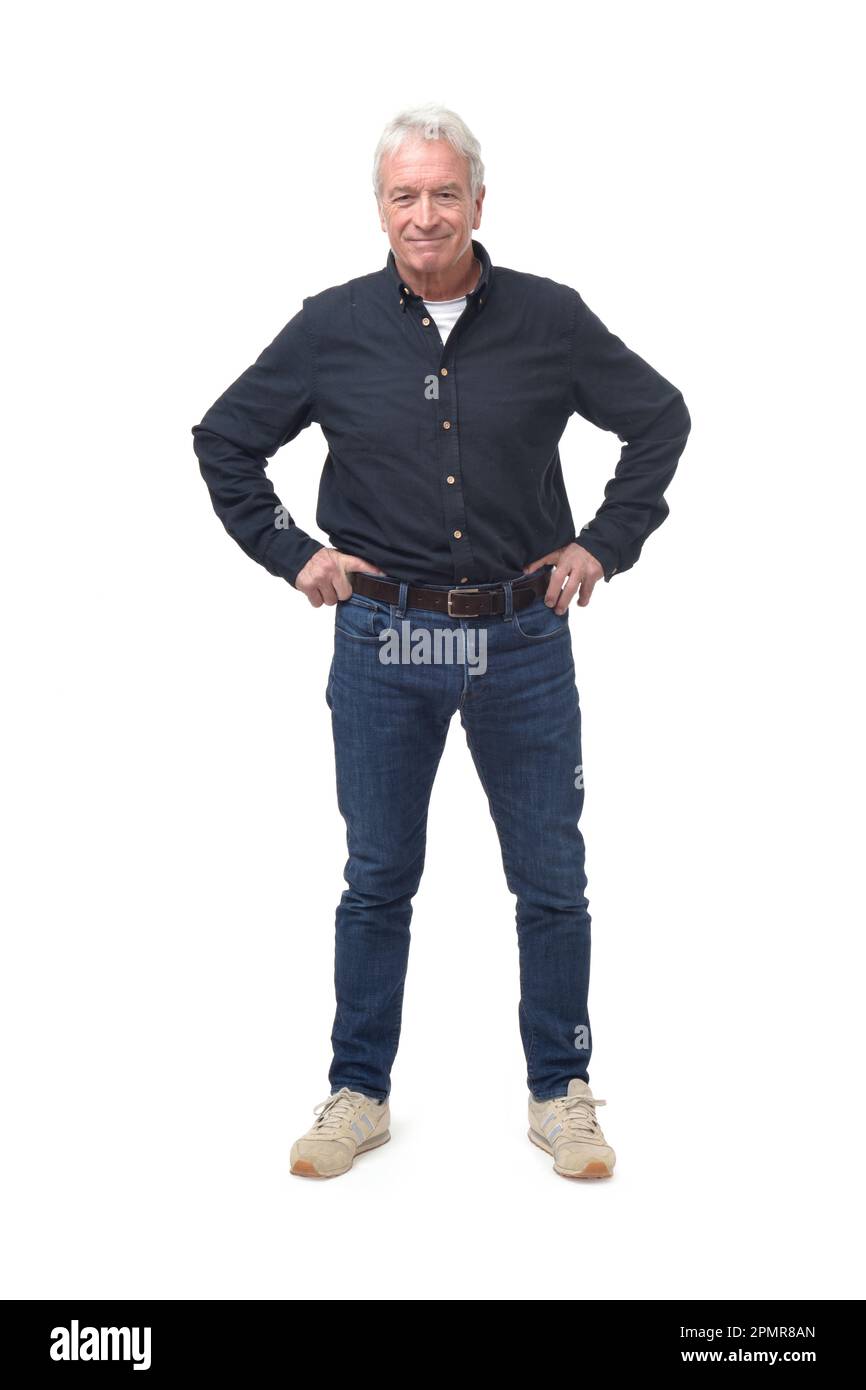 front view of a portrait of a man two arms akimbo on white background ...
