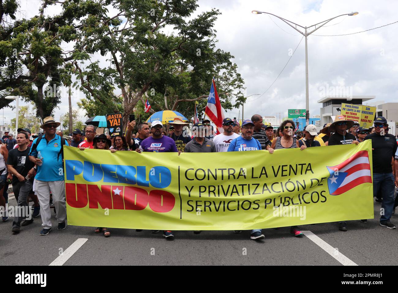 A large group of people marching to protest against the Privatization ...