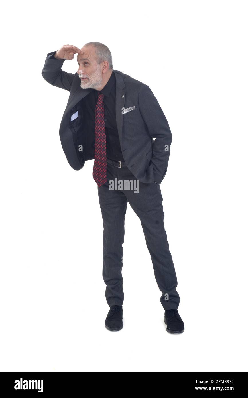 side view of standing man looking away with hand on forehead on white ...