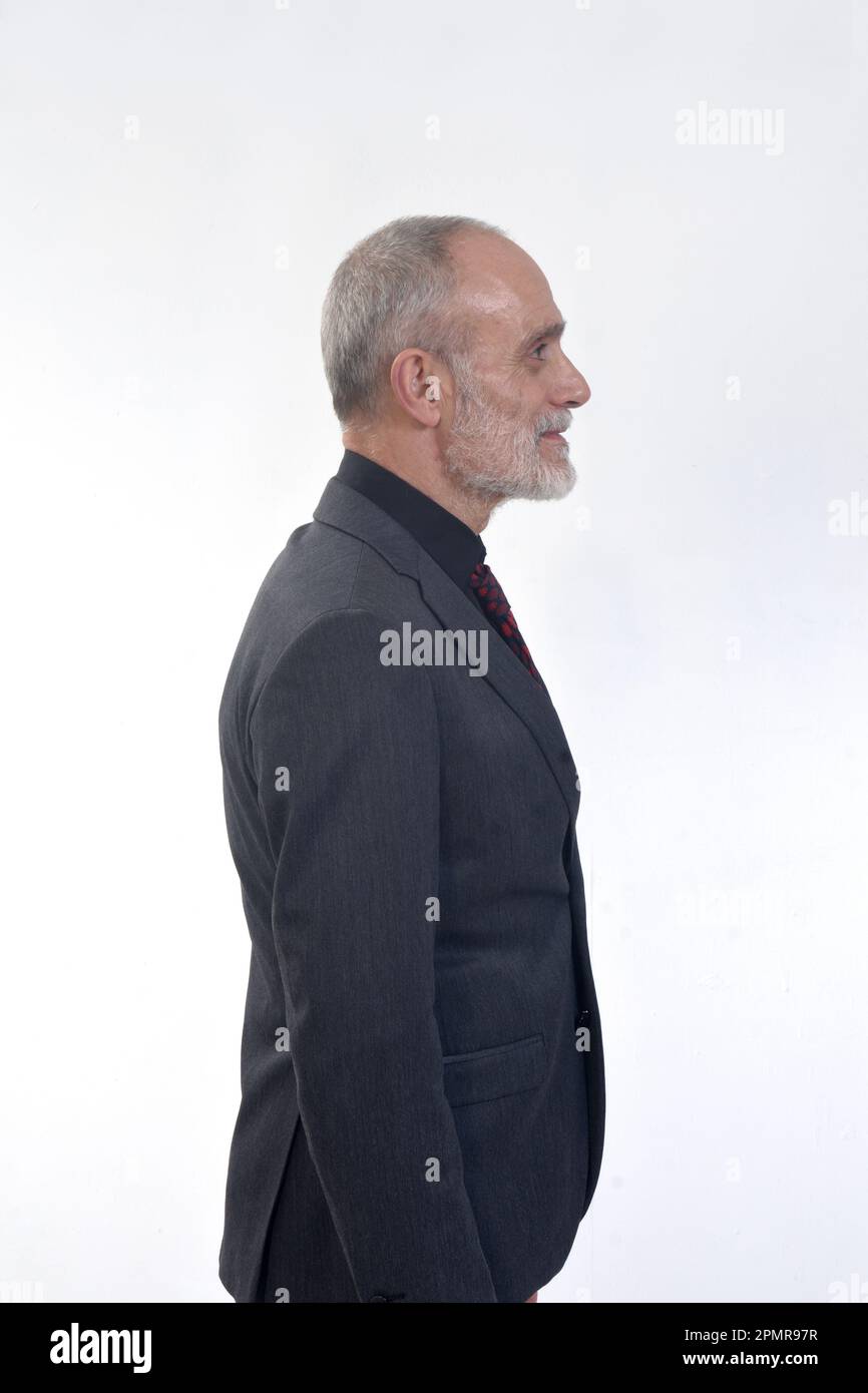 side view of a portrait of a man with suit and tie on white background ...