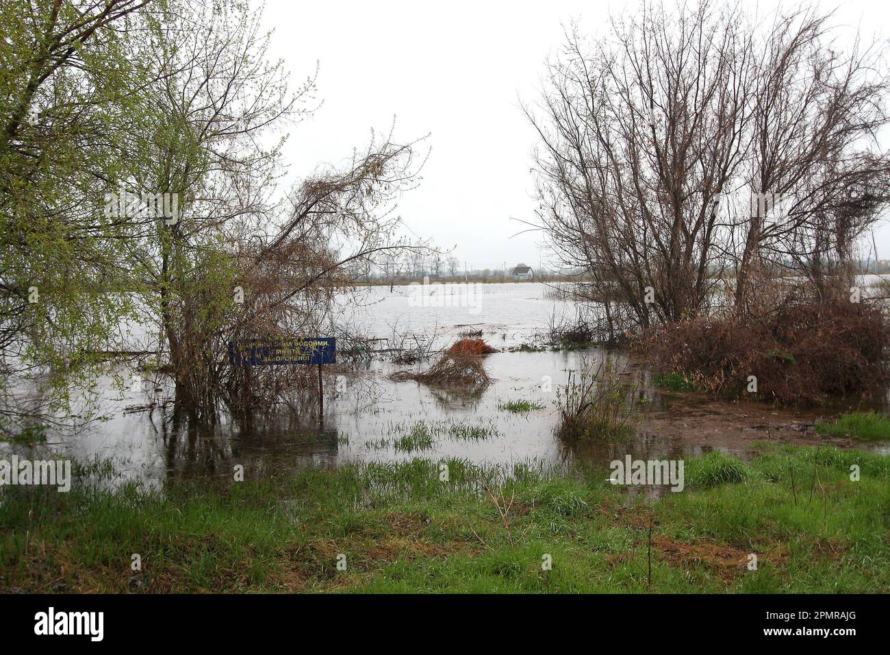 POHREBY, UKRAINE - APRIL 14, 2023 - The level of water in a local pond ...