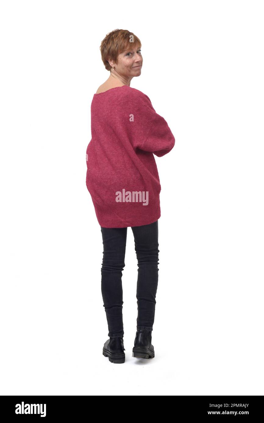 full length portrait of woman standing from back in tight jeans with ...
