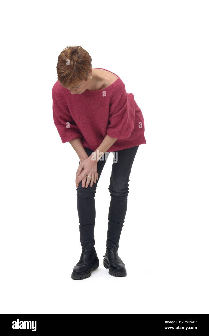 full length portrait of a woman in knee pain in isolated on white Stock ...