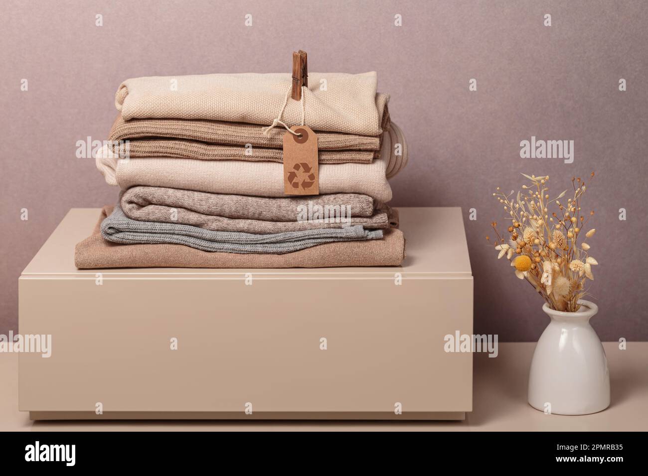 Stack of second hand clothes with used wardrobe for reuse Stock Photo ...