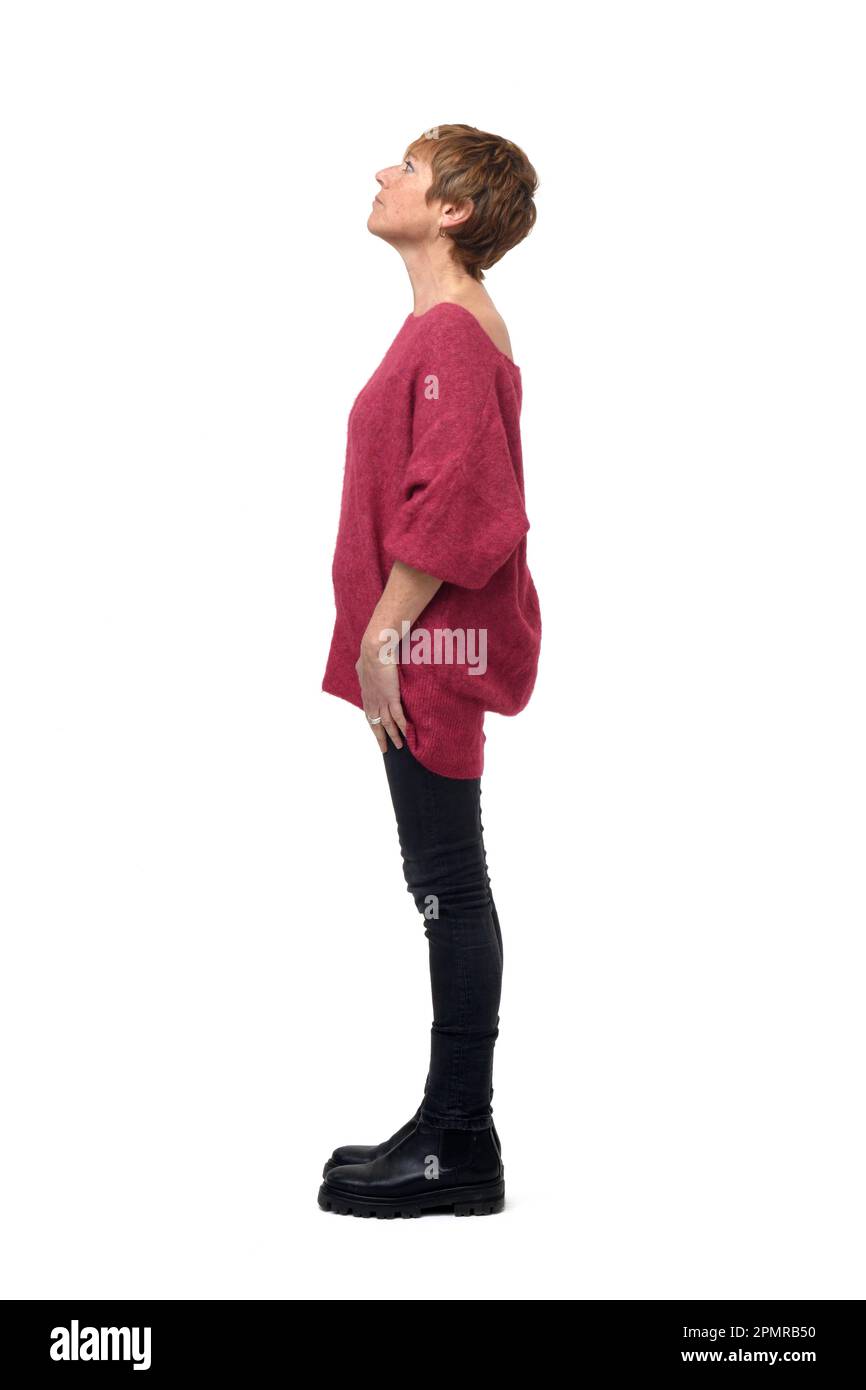 side view of a woman standing and looking up on white background Stock ...