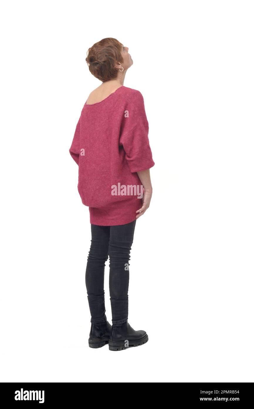 side back view of full length portrait of woman standing and looking up ...