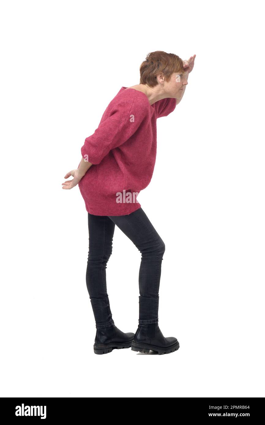 side view of standing woman looking away with hand on forehead on white ...