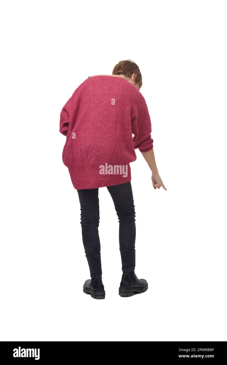 back view of a crouched woman looking at down and pointing finger at ...