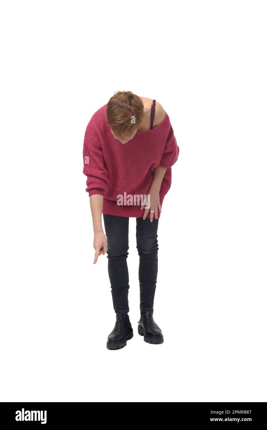 front view of a crouched woman looking at down and pointing finger at ...