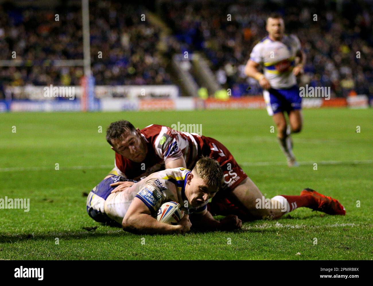 Warrington Wolves' Matty Nicholson scores a try during the Betfred ...