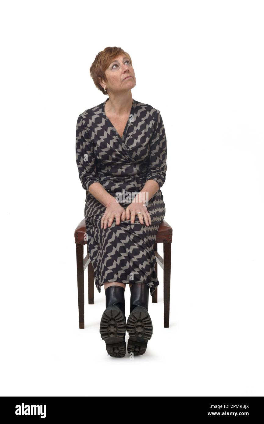 Mature woman sitting legs up Cut Out Stock Images & Pictures - Alamy