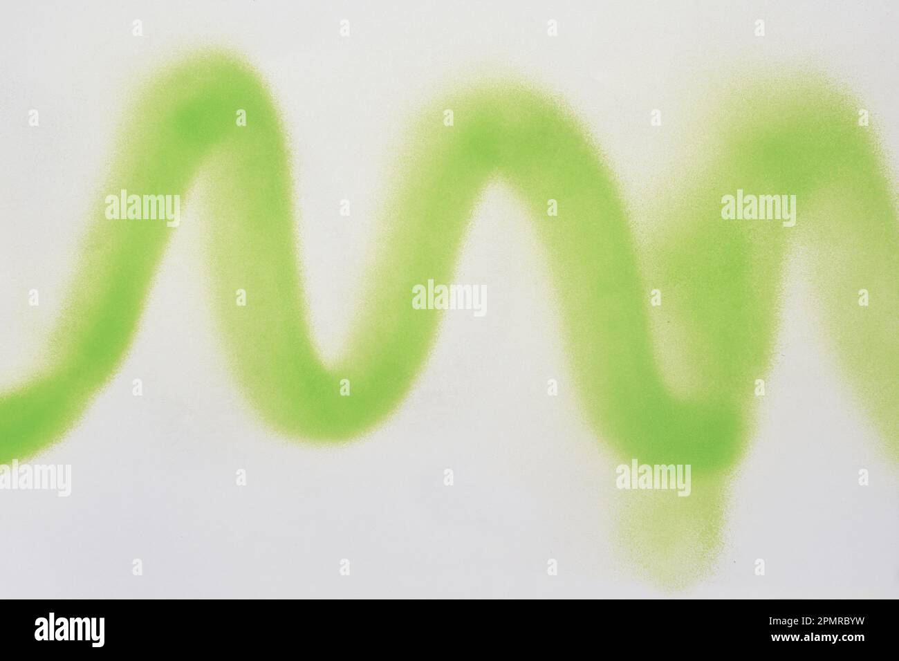 wavy line of green spray paint on white paper background Stock Photo ...