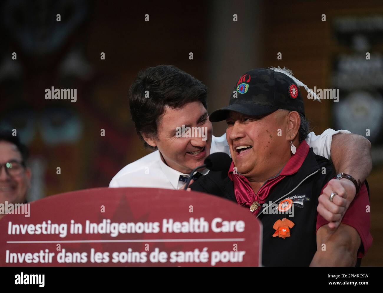 Canada's Prime Minister Justin Trudeau embraces Wayne Christian , right ...