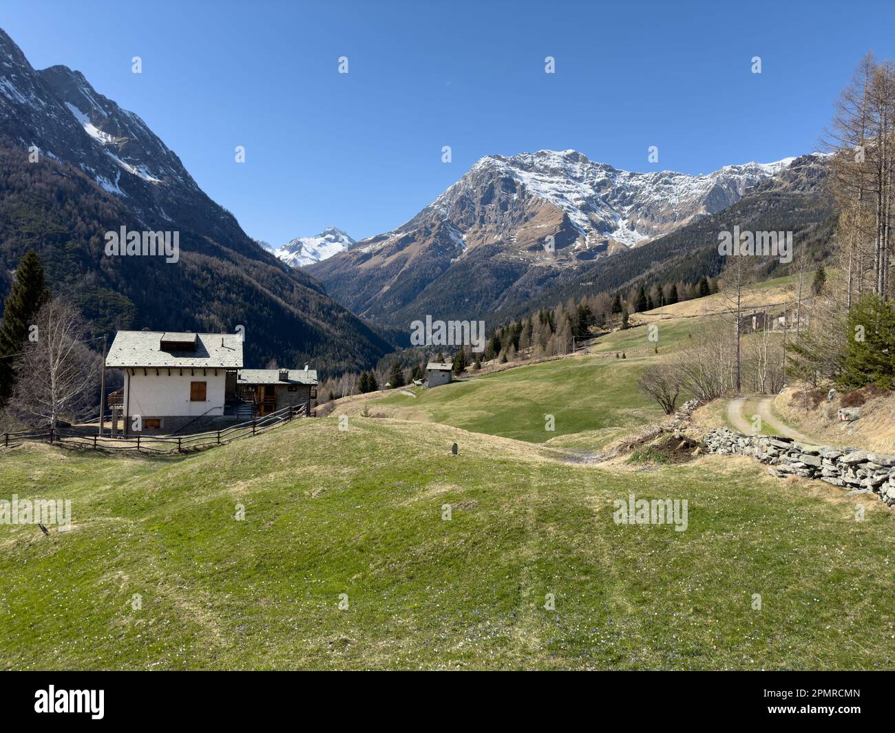 a beautiful view of the mountain path leading to Lake Palu, Valtellina ...