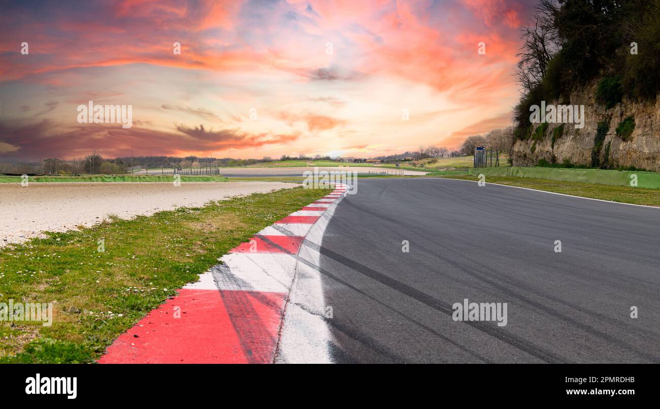 Motor sport asphalt race track and curbs with skid marks, low angle ...