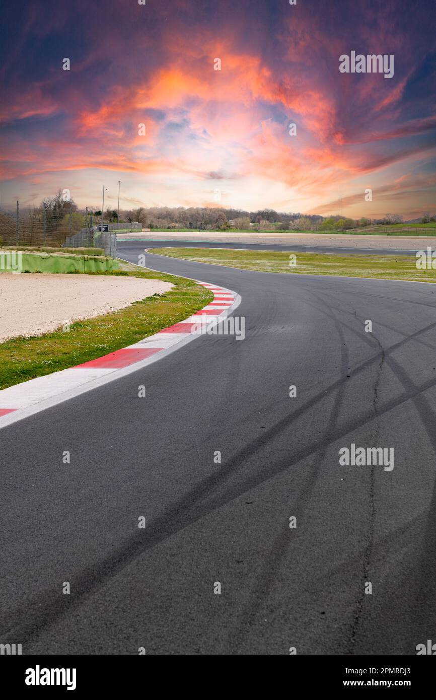 Motor sport asphalt race track and curbs with skid marks, low angle ...
