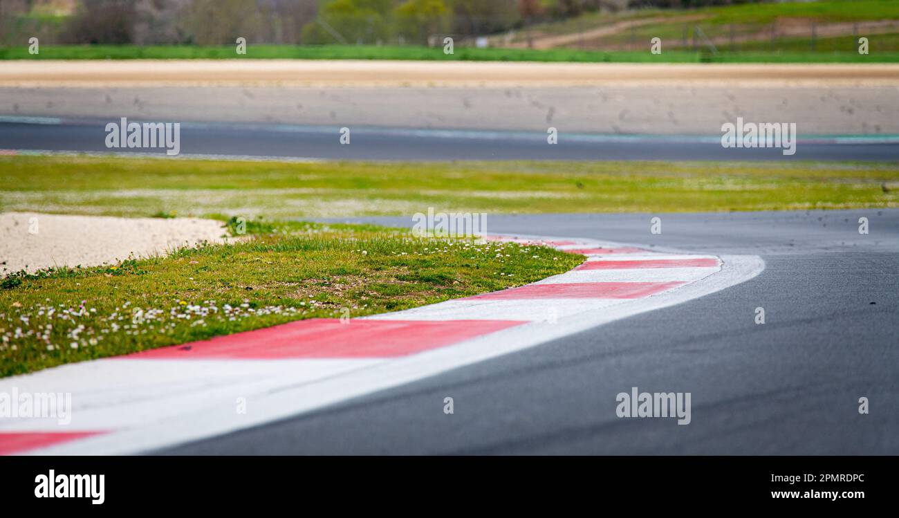Motor sport asphalt race track and curbs close up, selective focus low ...