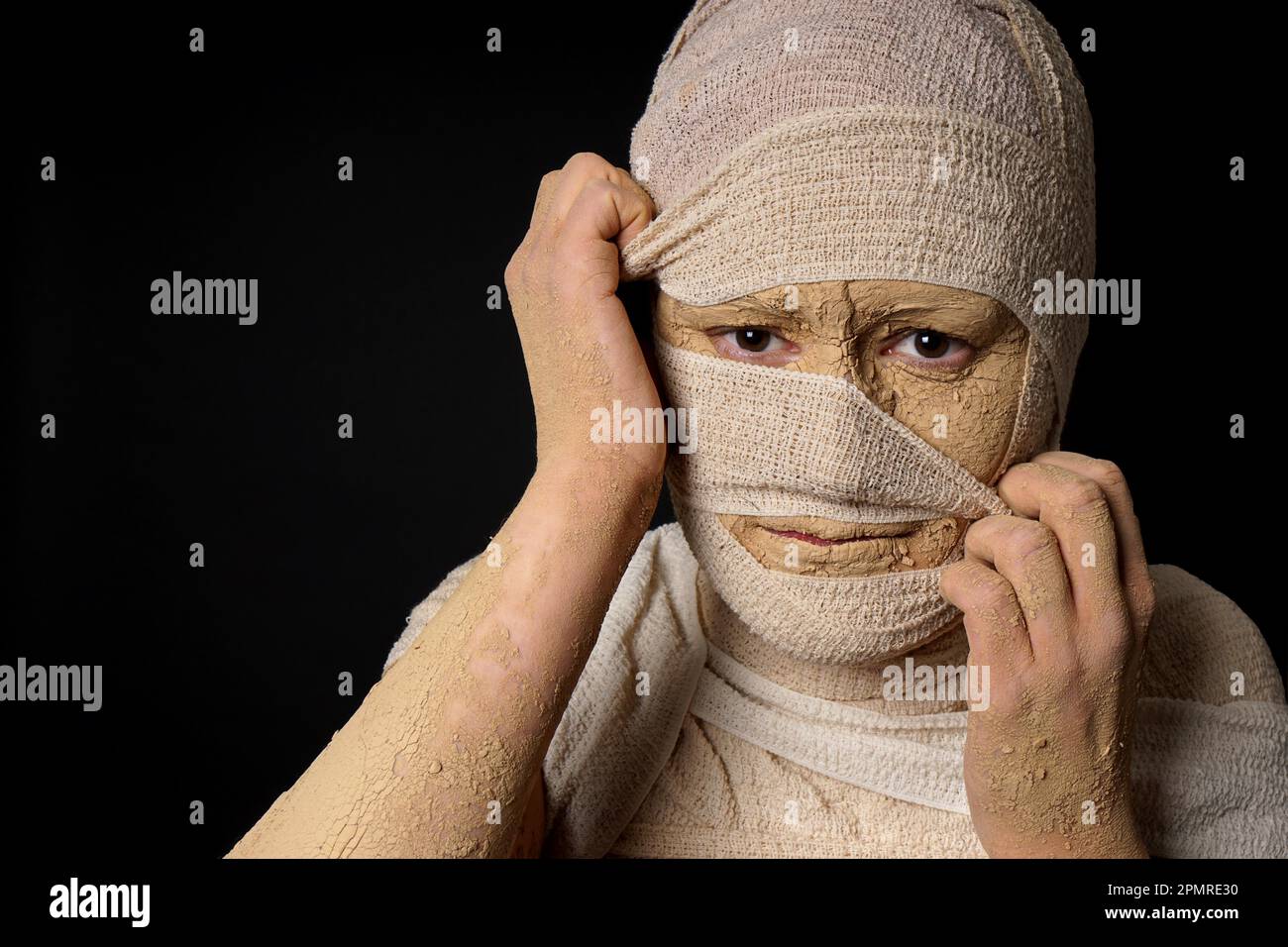 female egyptian mummy pulling at bandages halloween concept Stock Photo ...