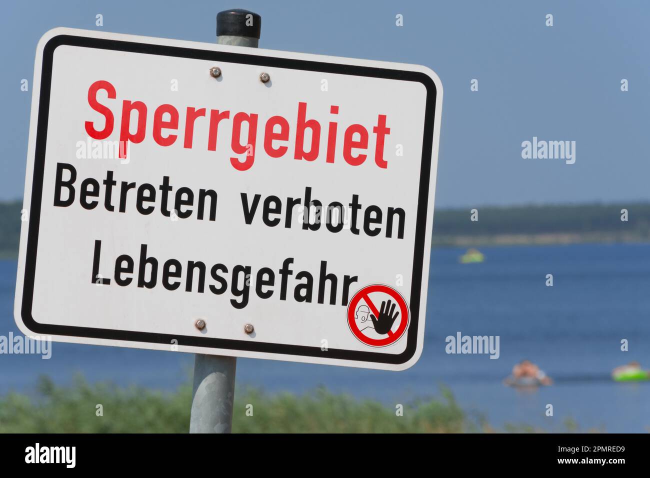 Bathing ban in the restricted area. Warning sign with the German text ...