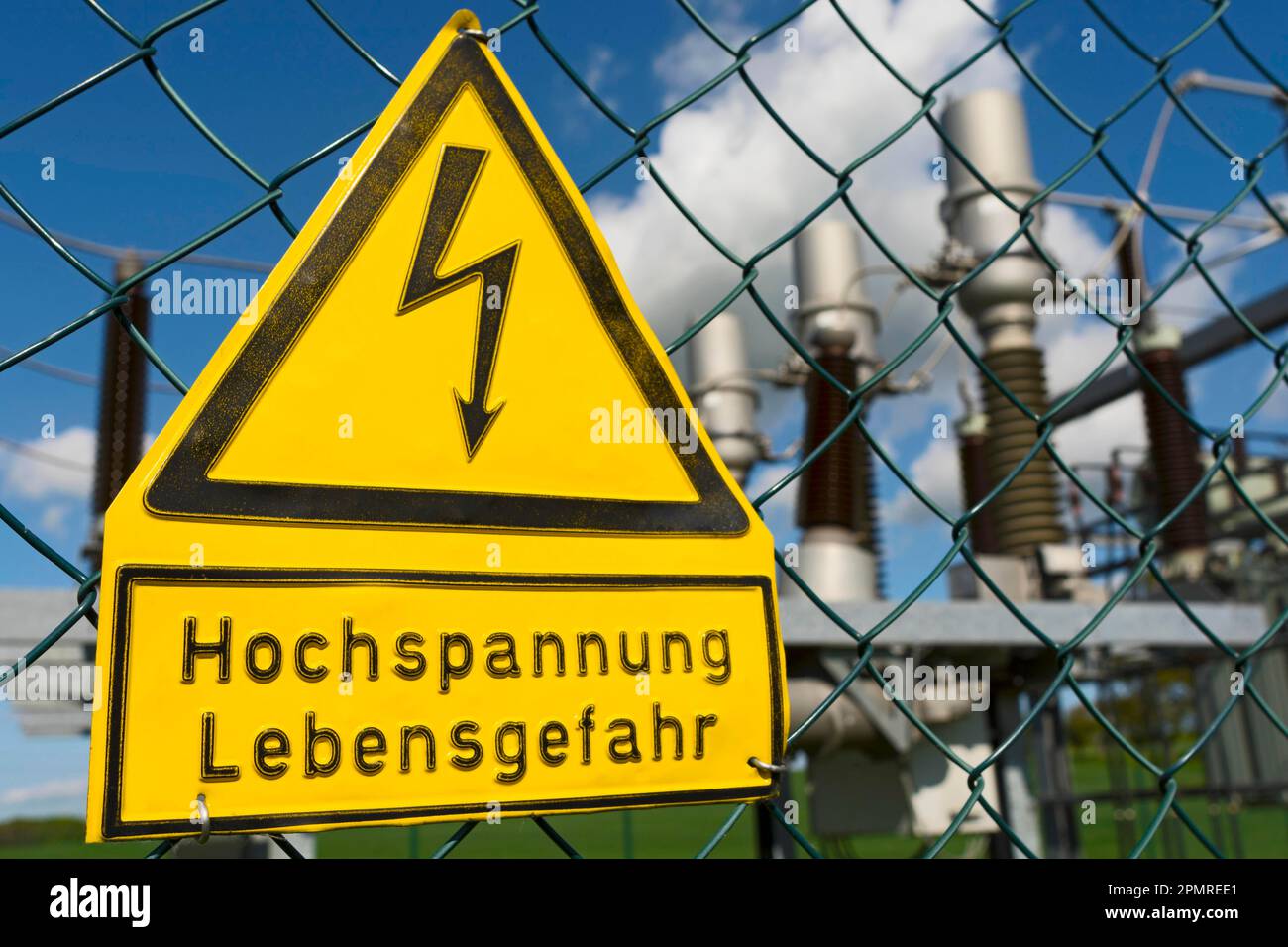Warning sign: high voltage danger to life Stock Photo - Alamy