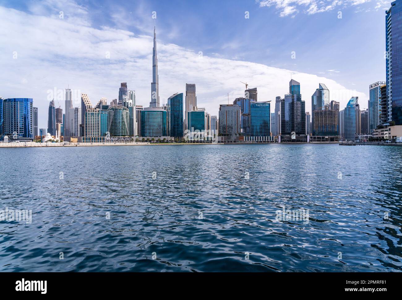 Dubai, UAE - April 2, 2023: Skyline of downtown district from water ...