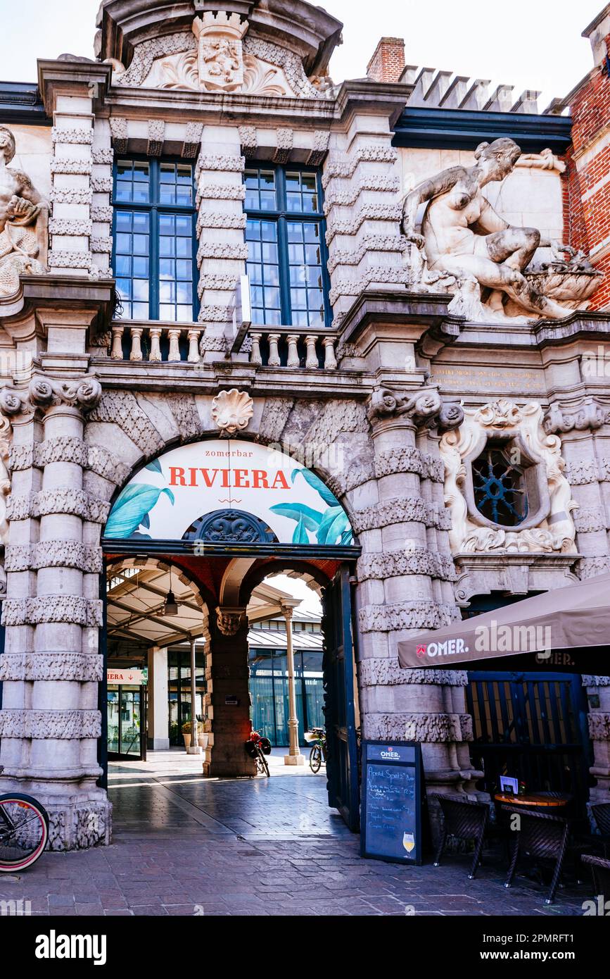 Monumental entrance gate of the Old Fish Market. A man and a woman ...
