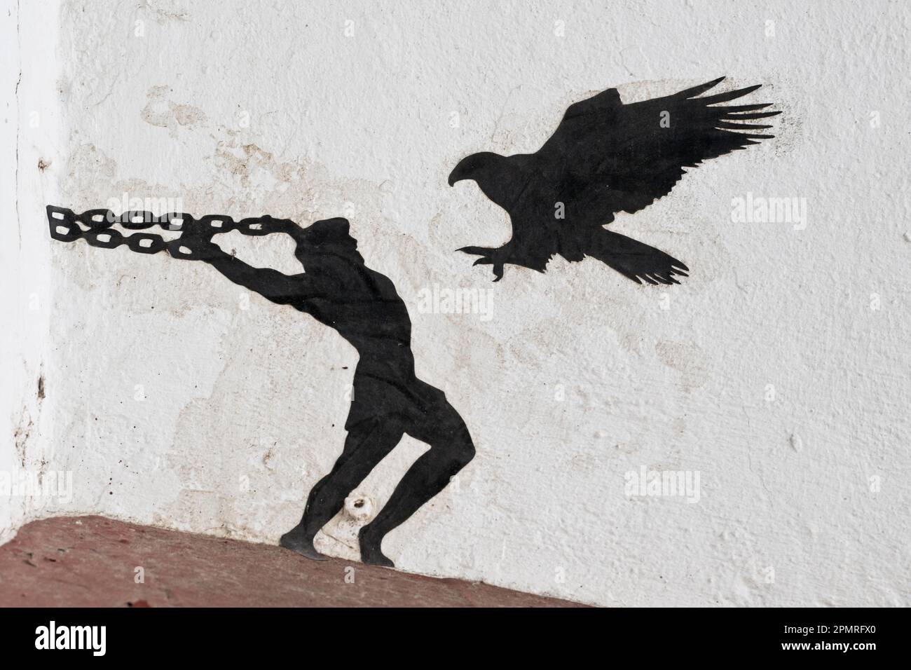 Prometheus and the Eagle, silhouette on a house wall, Seville ...