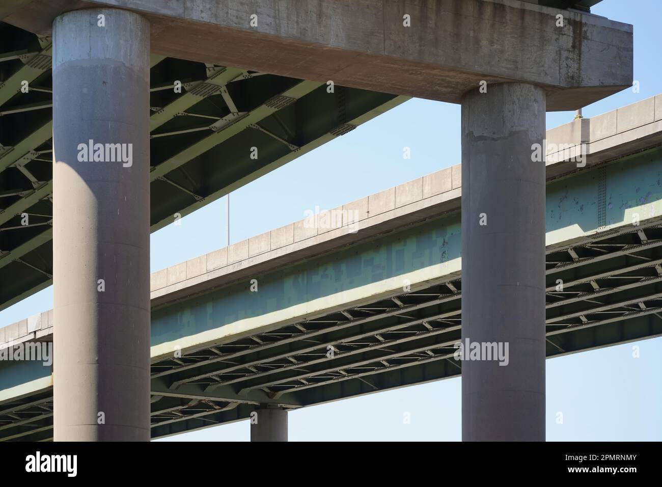 Abstract view of elevated interstate highway from below. Concrete ...
