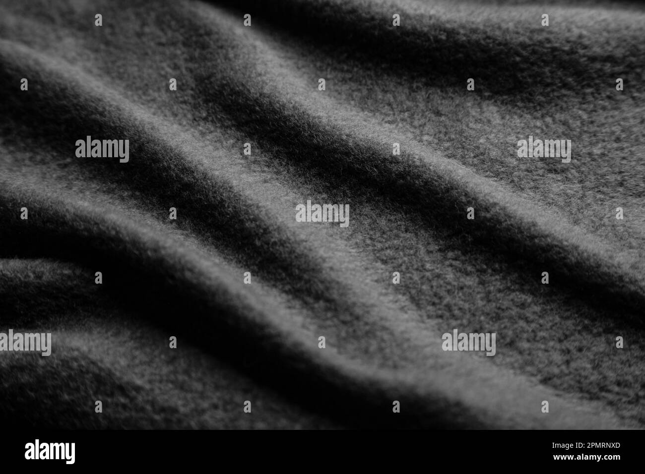 Texture of warm woolen fabric with folds. Gray wavy felt background ...