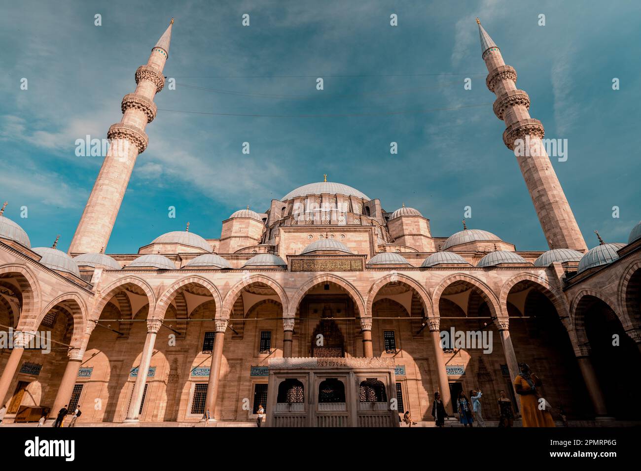 A low angle shot of The Sultan Suleiman Mosque under the blue sky and ...
