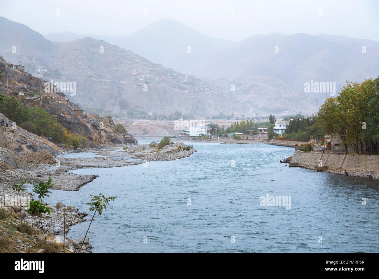 A beutiful photo of Kokcha river passing through villages in a foggy ...