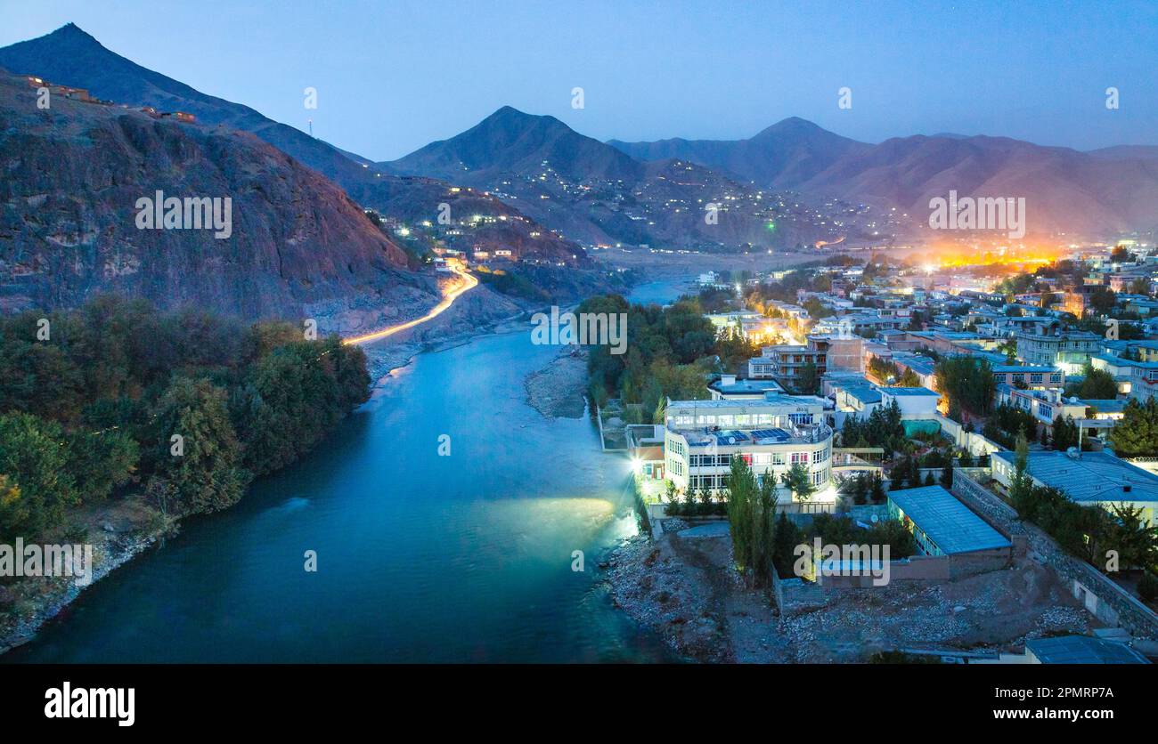A long shutter photo of Fayzabad City with a view of Kokcha river in a ...