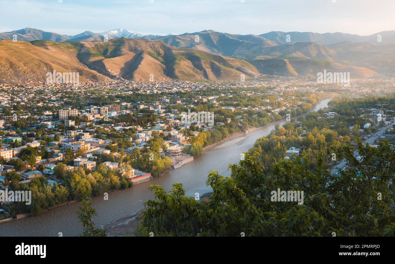A horizontal photo of Fayzabad cityscape with a view of Kokcha river ...