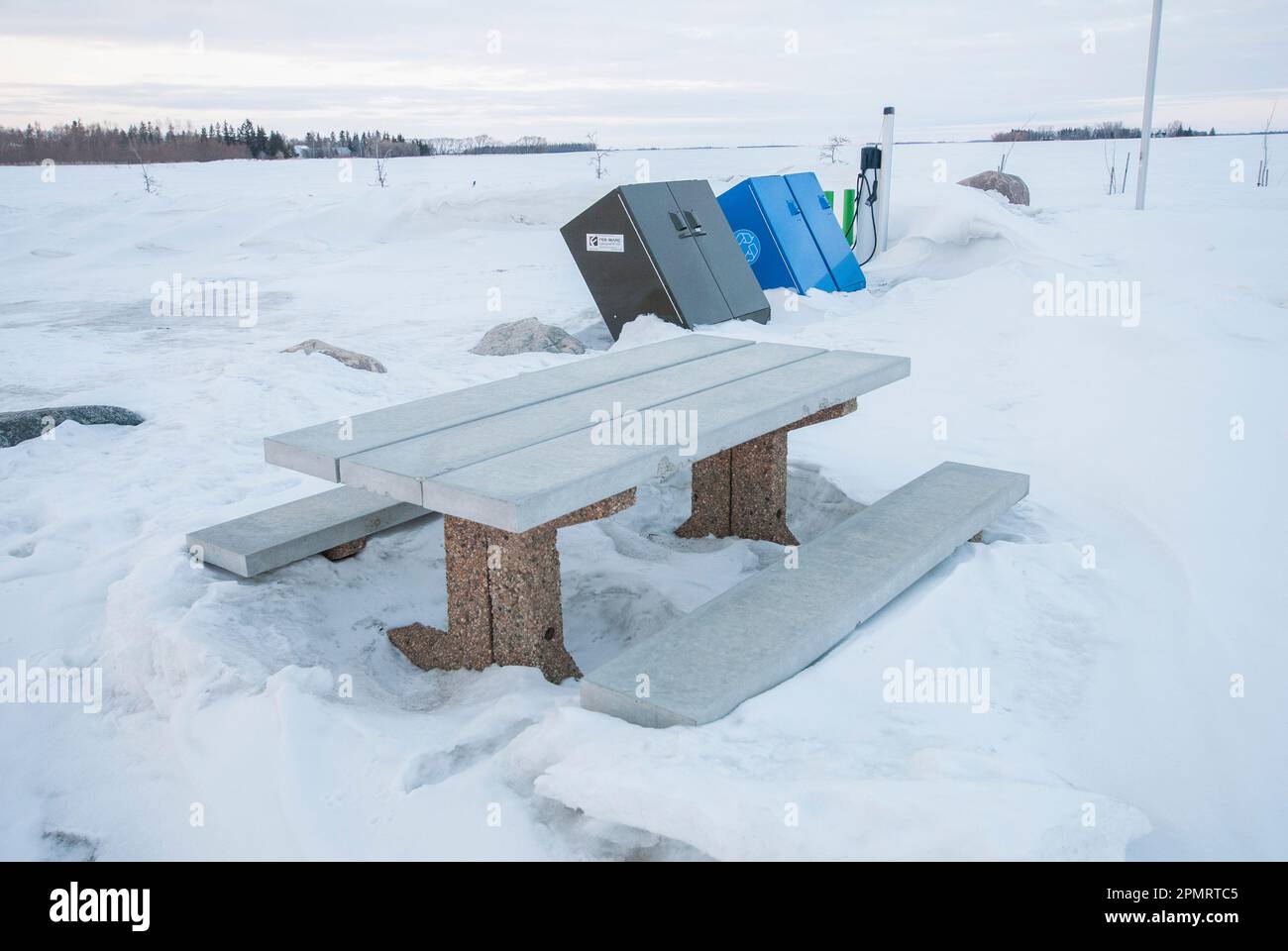Picnic table buried in snow at the longitudinal centre of Canada in ...