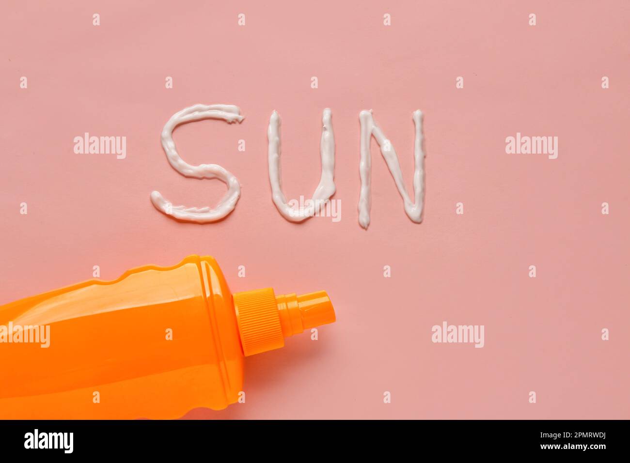 Word SUN made of sunscreen cream on pink background Stock Photo - Alamy