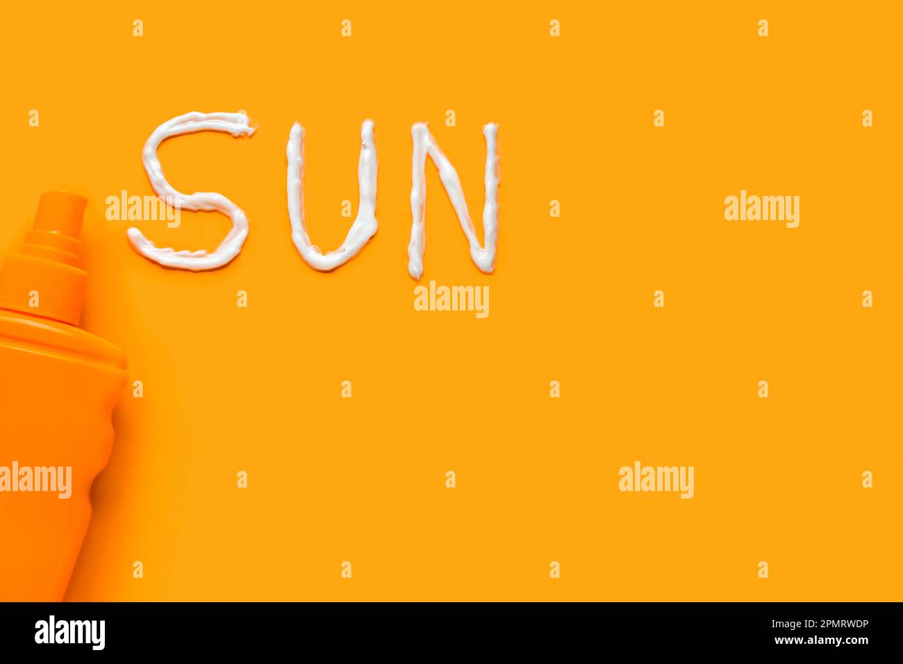 Word SUN made of sunscreen cream on orange background Stock Photo - Alamy