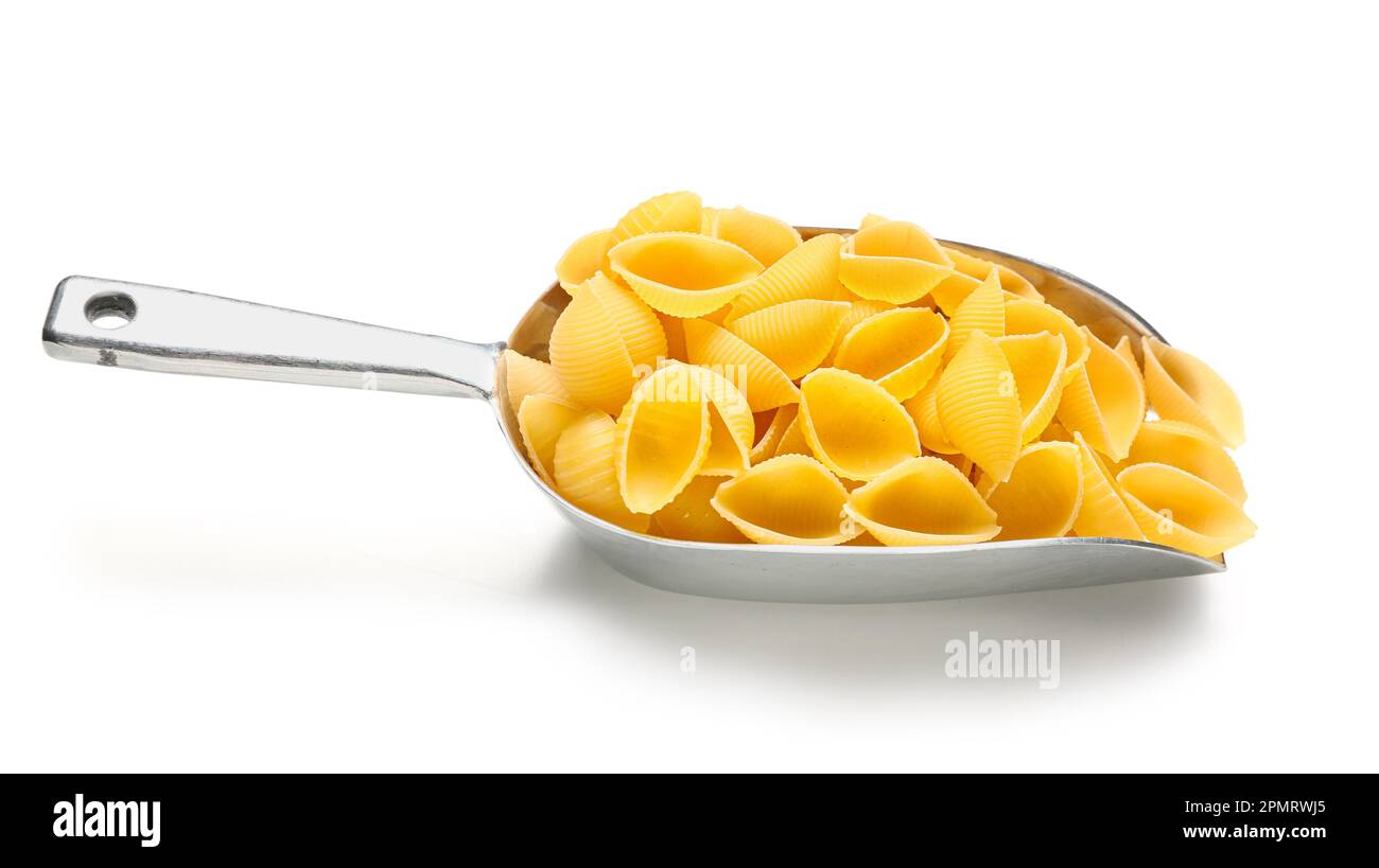 Scoop of raw conchiglie pasta isolated on white background Stock Photo ...