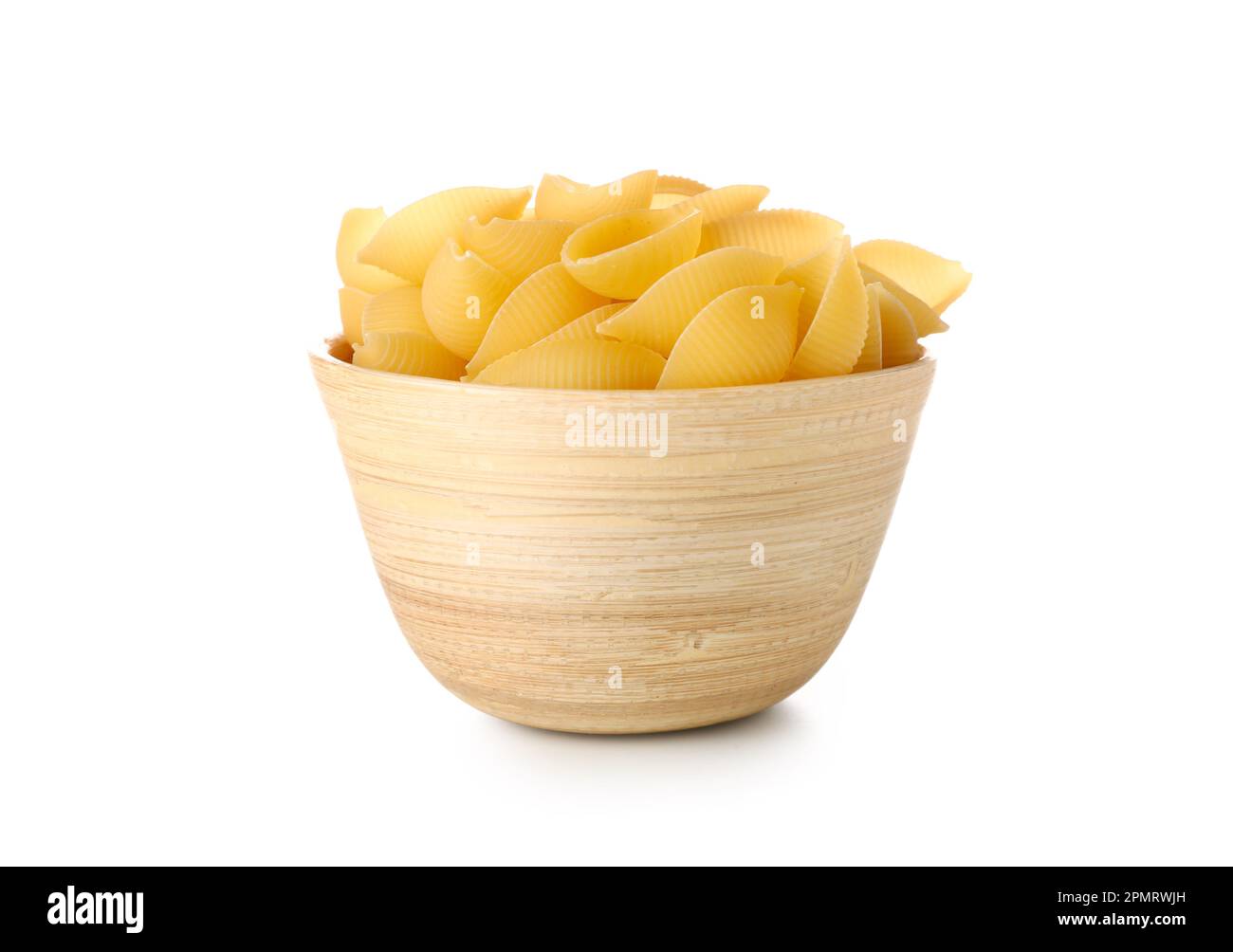 Bowl of raw conchiglie pasta isolated on white background Stock Photo ...