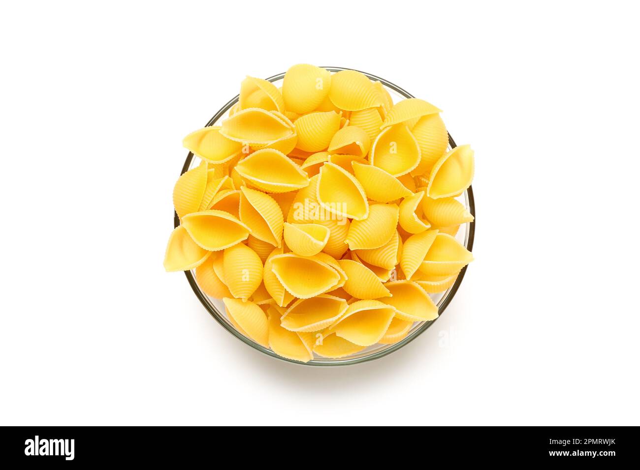 Bowl of raw conchiglie pasta isolated on white background Stock Photo ...