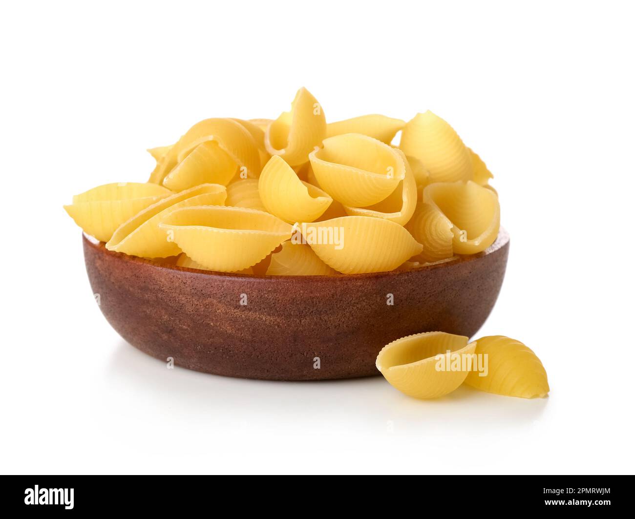 Bowl of raw conchiglie pasta isolated on white background Stock Photo ...