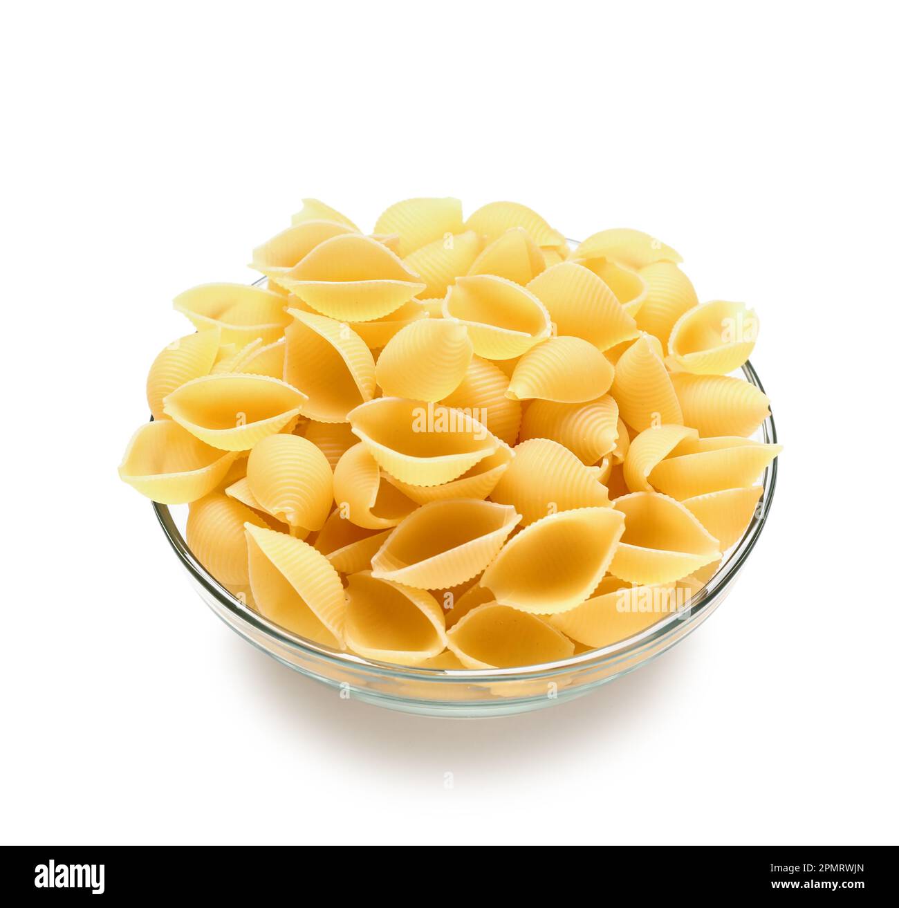 Bowl of raw conchiglie pasta isolated on white background Stock Photo ...