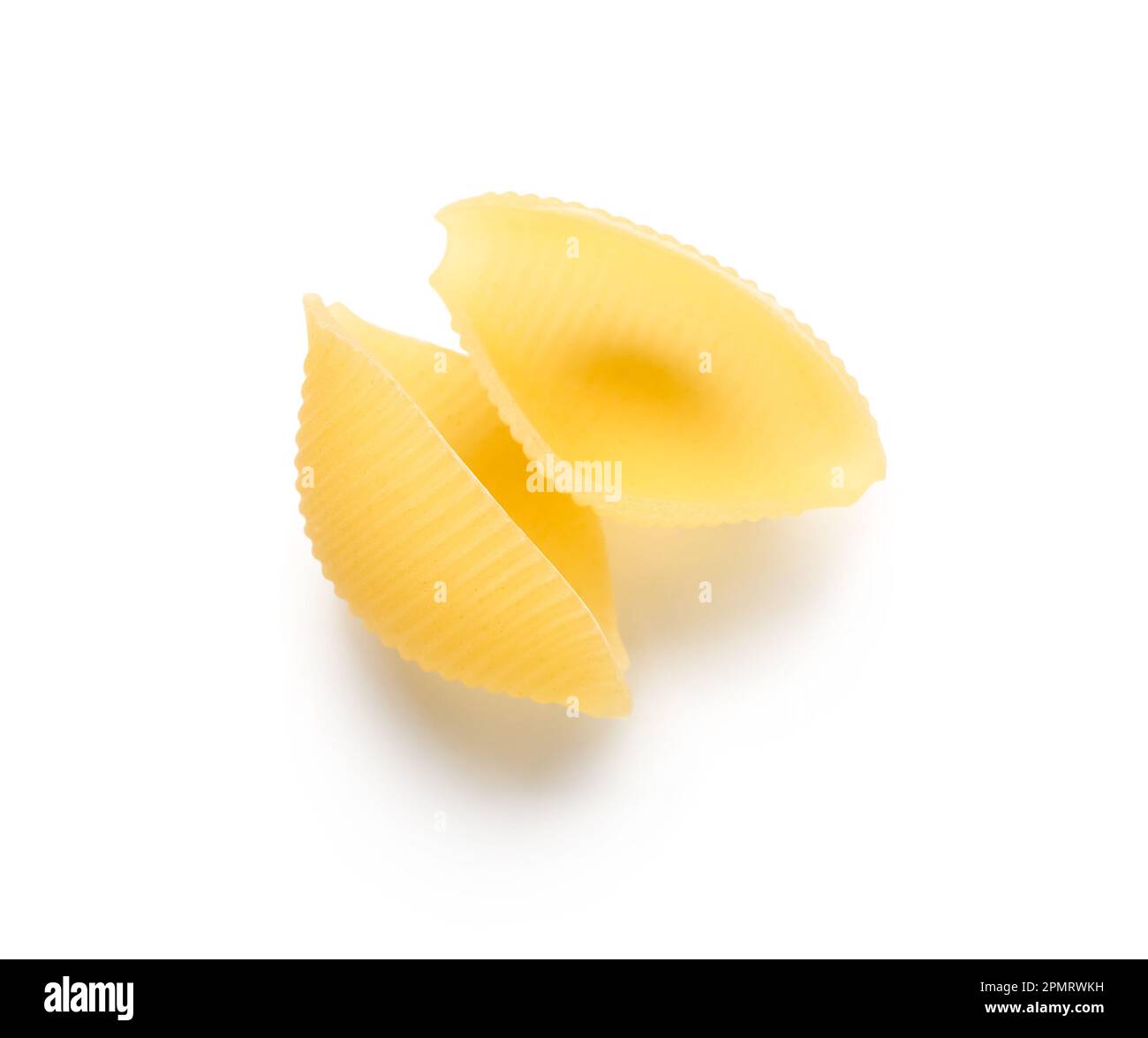 Raw conchiglie pasta isolated on white background Stock Photo - Alamy