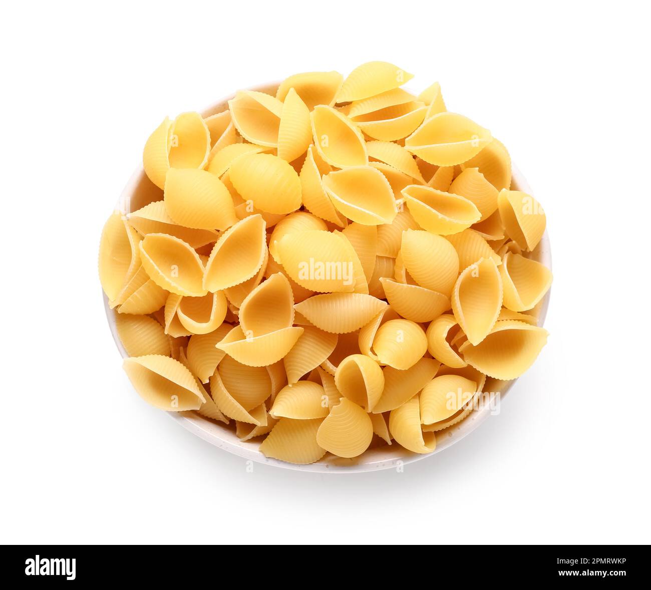 Bowl with raw conchiglie pasta isolated on white background Stock Photo ...