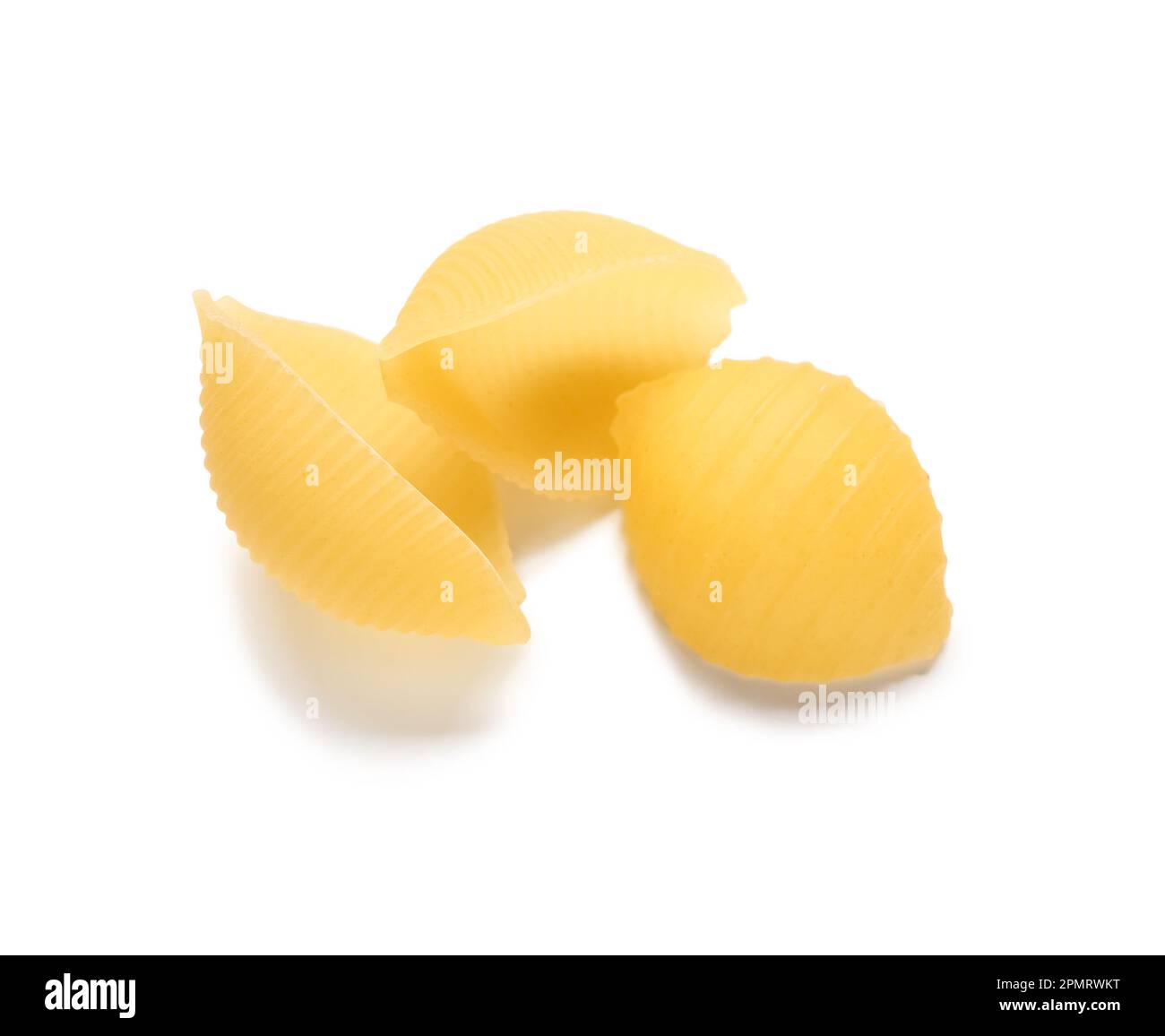 Raw conchiglie pasta isolated on white background Stock Photo - Alamy