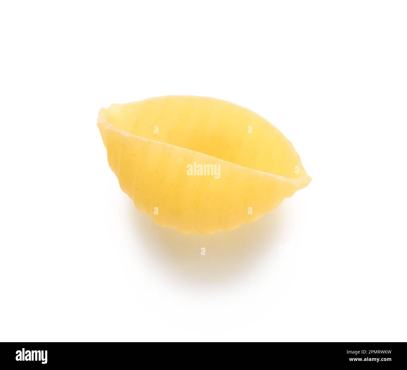 Raw conchiglie pasta isolated on white background Stock Photo - Alamy