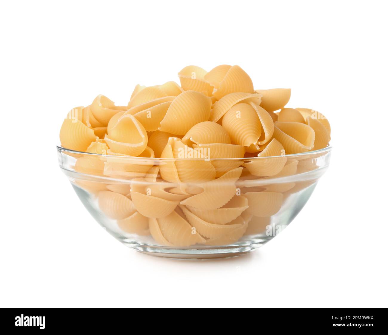 Bowl of raw conchiglie pasta isolated on white background Stock Photo ...
