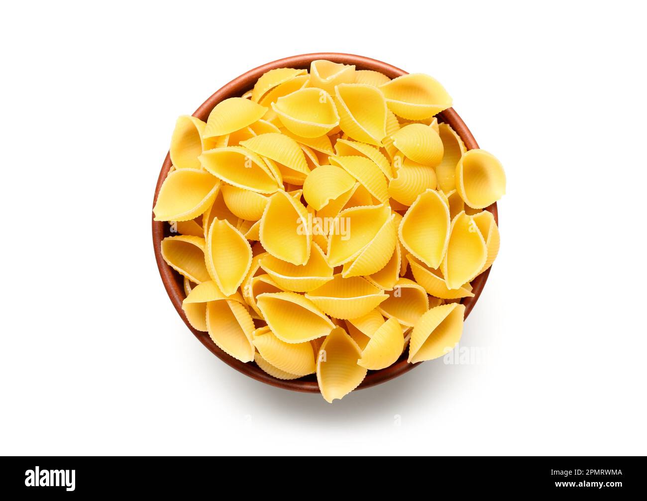 Bowl of raw conchiglie pasta isolated on white background Stock Photo ...