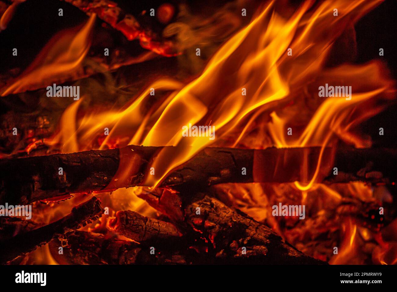 A glowing burning bonfire outdoors at night - great for wallpapers ...