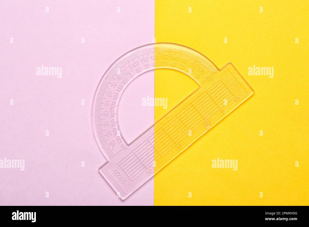 Transparent plastic protractor on color background Stock Photo - Alamy