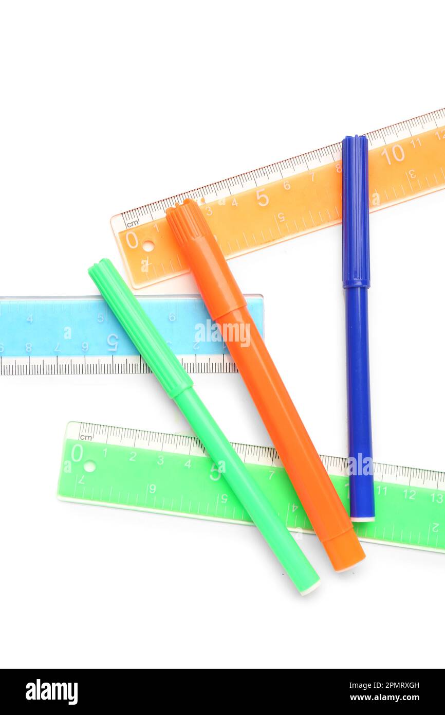 Colorful markers and rulers on white background Stock Photo - Alamy
